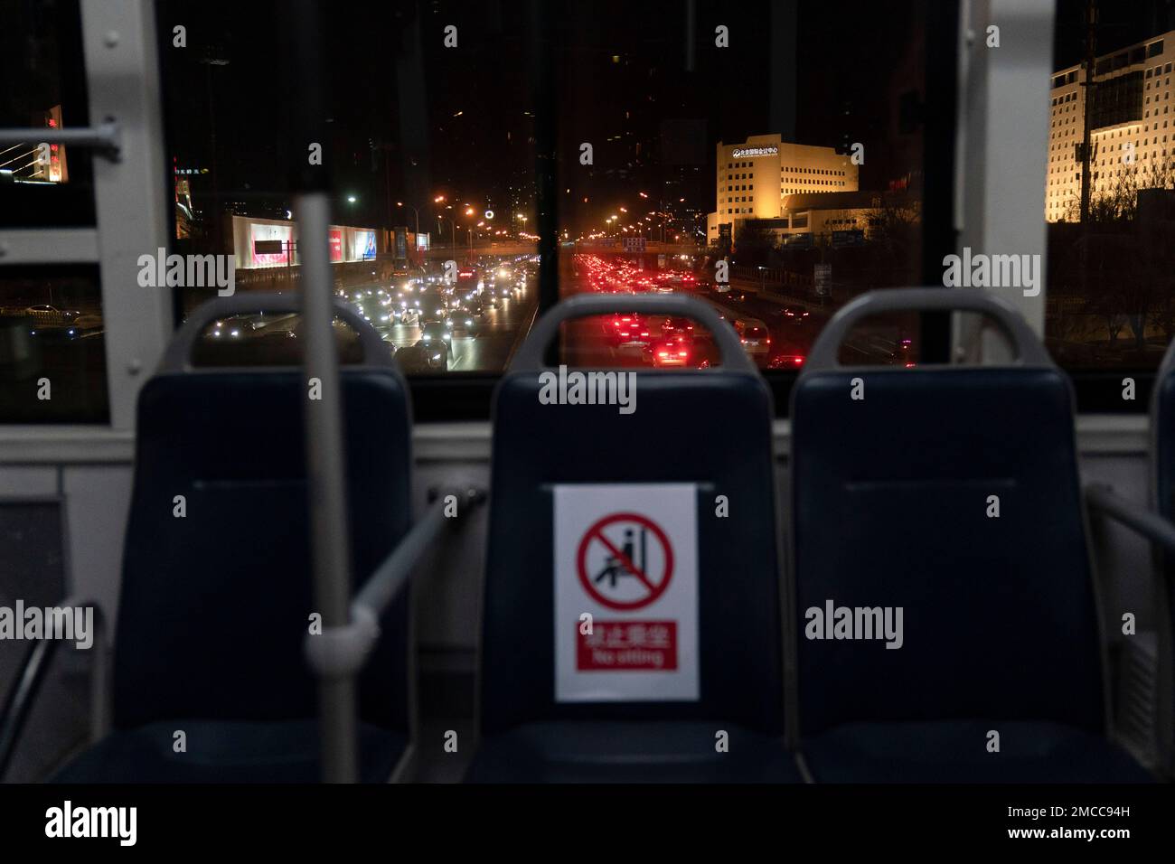 Evening rush hour traffic is seen through the window of an Olympic ...