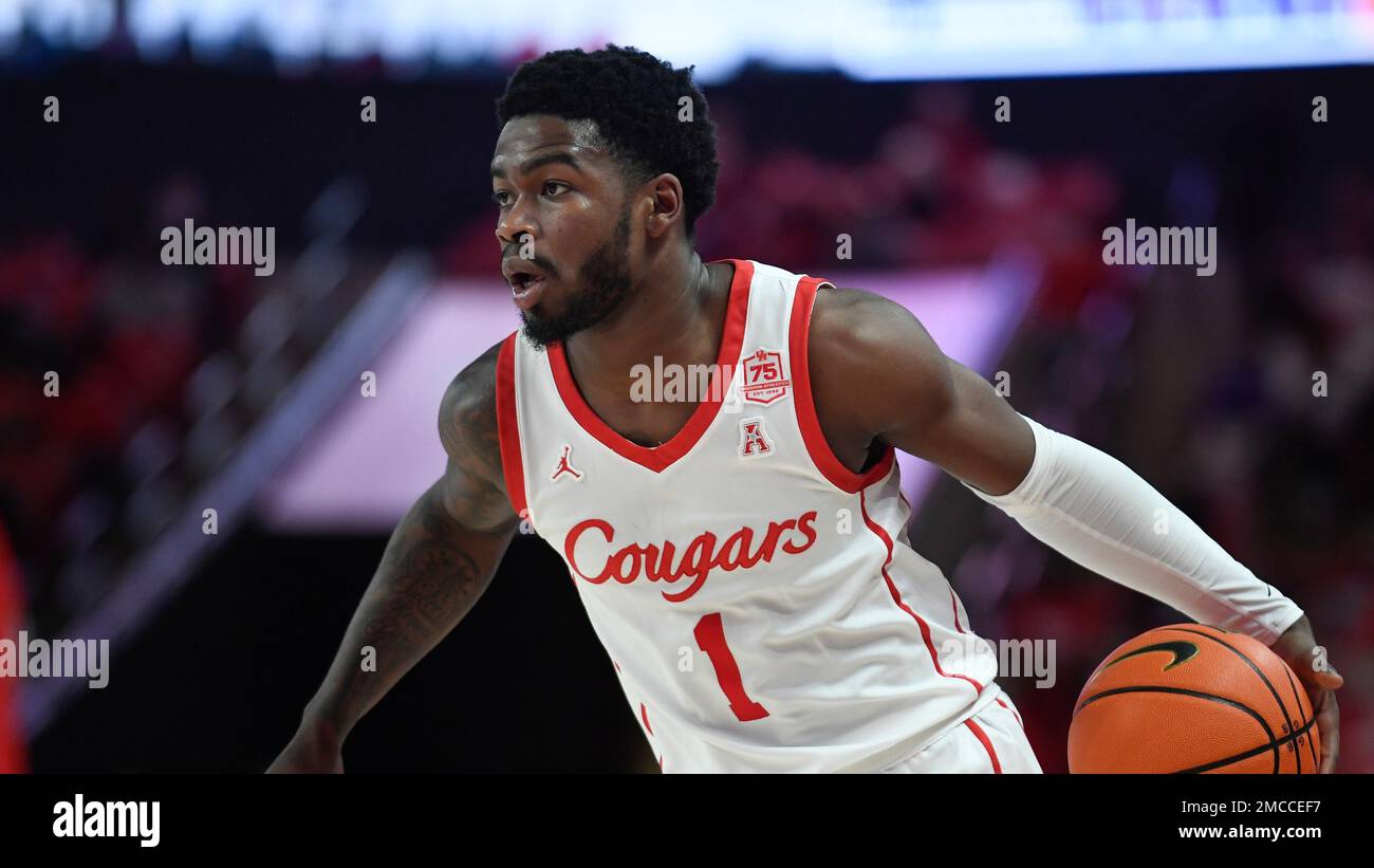 Houston guard Jamal Shead (1) dribbles the ball up the court against ...