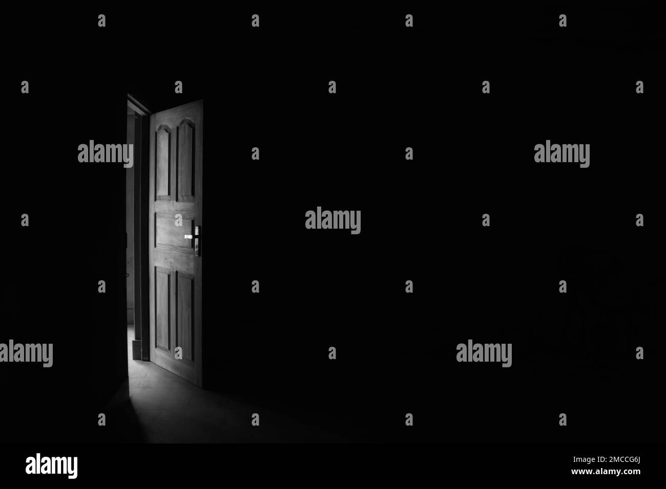 Dark room door light Black and White Stock Photos & Images - Alamy