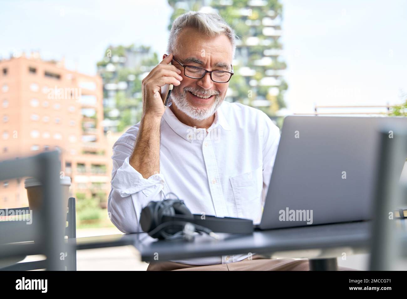 Happy man making phone call hi-res stock photography and images - Alamy
