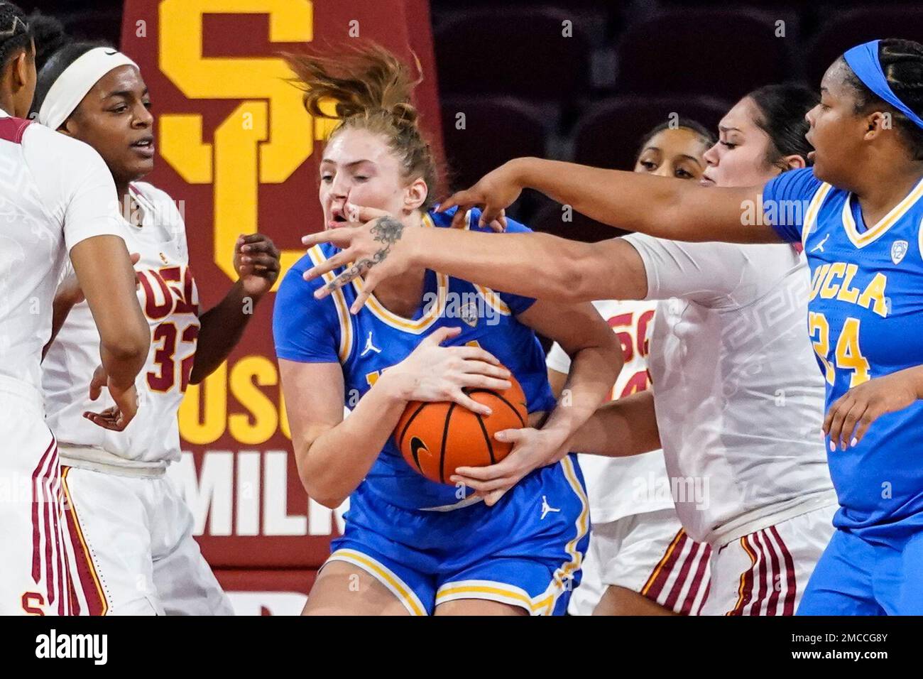 UCLA forward Izzy Anstey, center, is fouled by Southern California ...