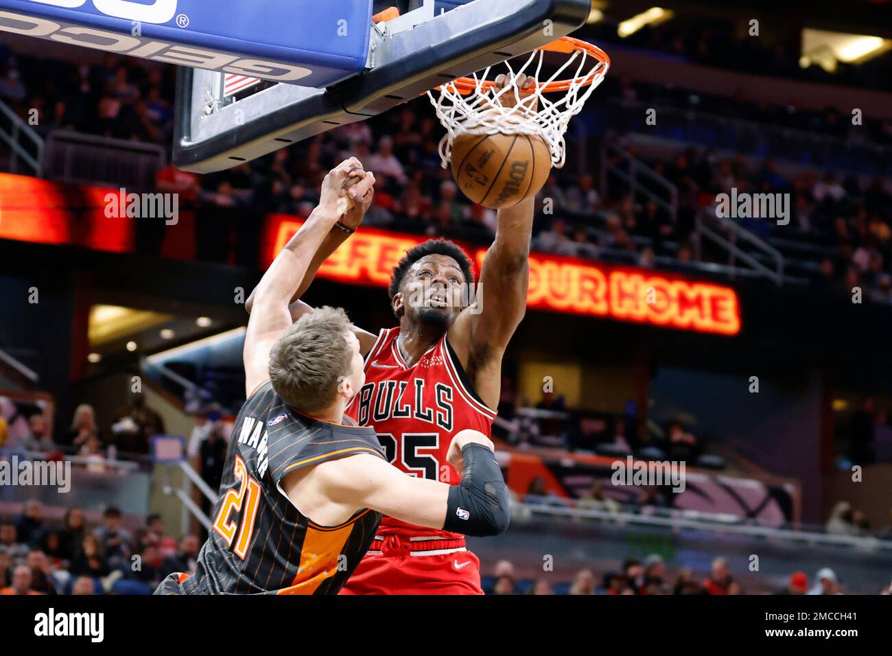 Chicago Bulls forward Tyler Cook (25) scores over Orlando Magic center ...