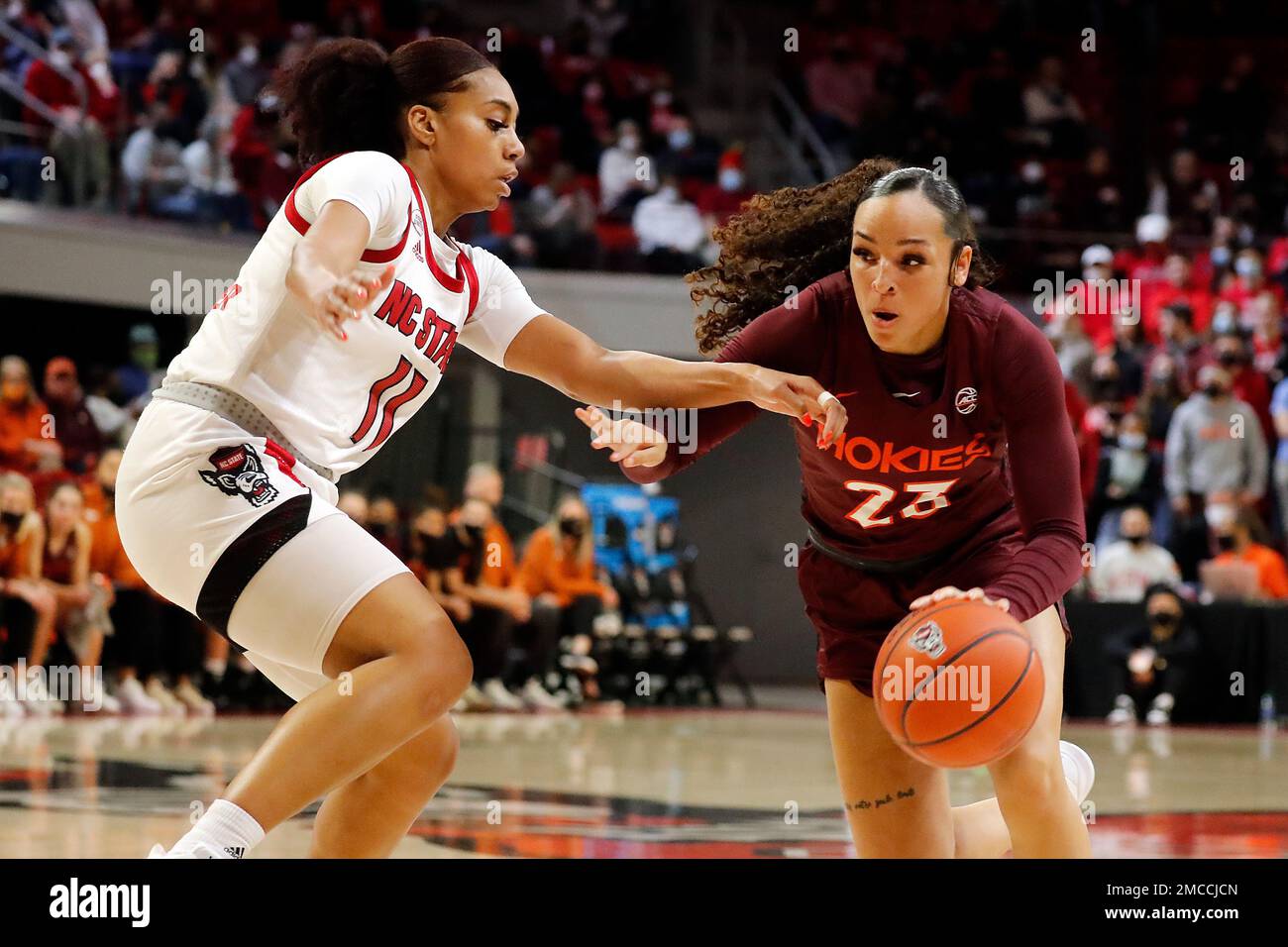 Virginia Tech's Kayana Traylor (23) tries to drive the ball around ...