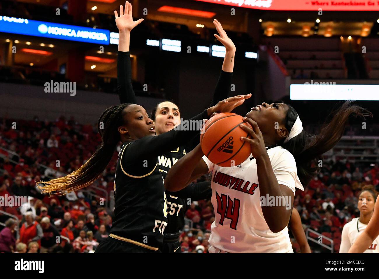 Wake Forest guard Elise Williams, left, tries to block the shot of ...