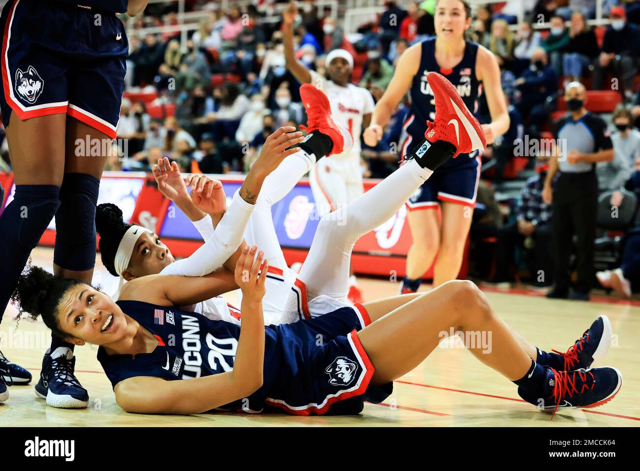 Connecticut forward Olivia Nelson-Ododa (20) gets tangled up against St ...