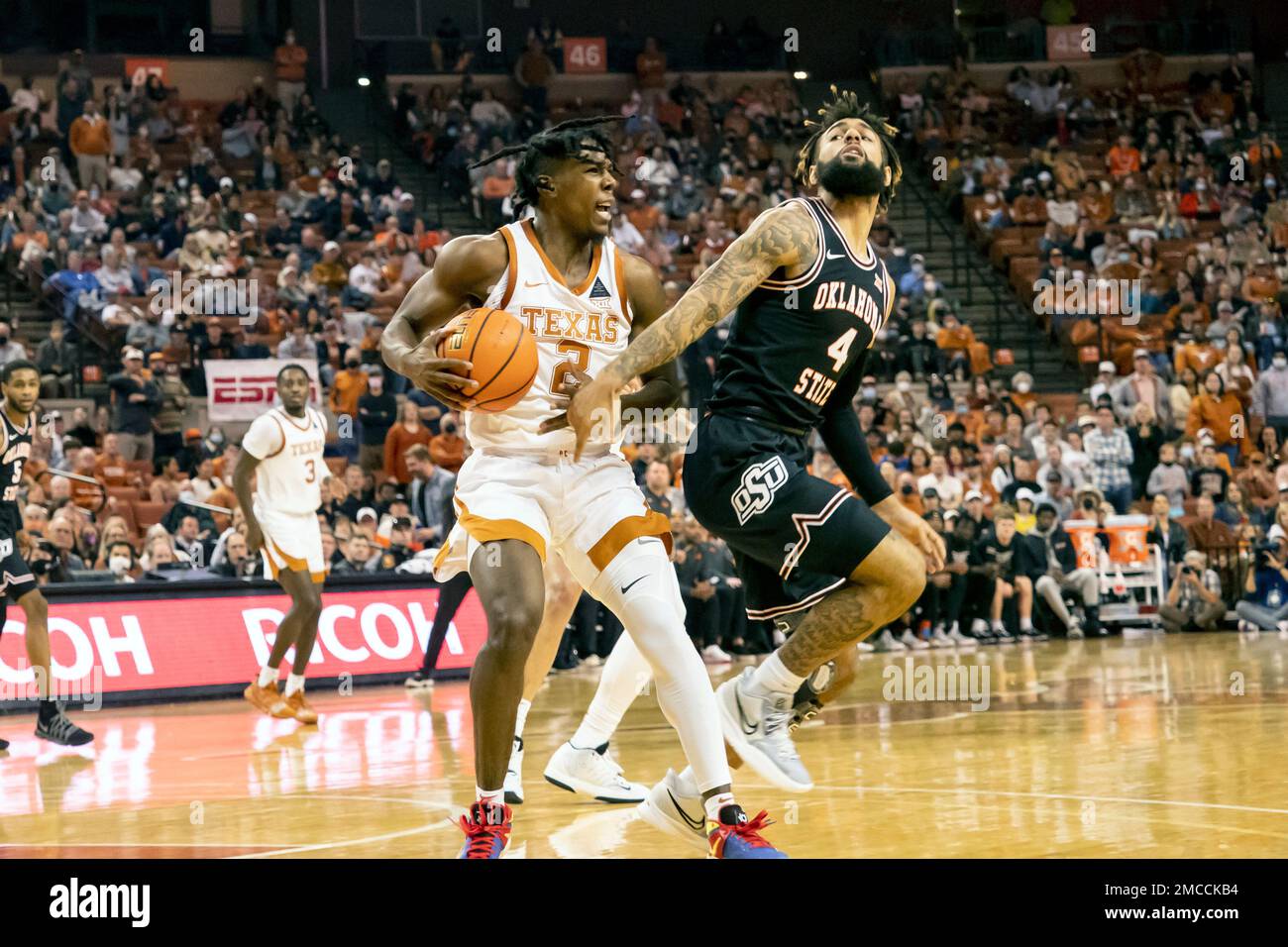 Oklahoma State guard Donovan Williams, right, defends against Texas ...