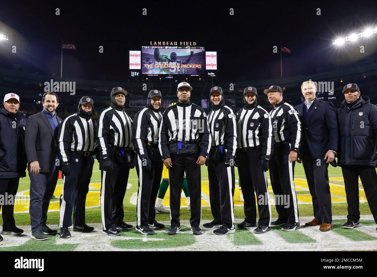 The officiating crew pose for a picture including line judge Rusty ...