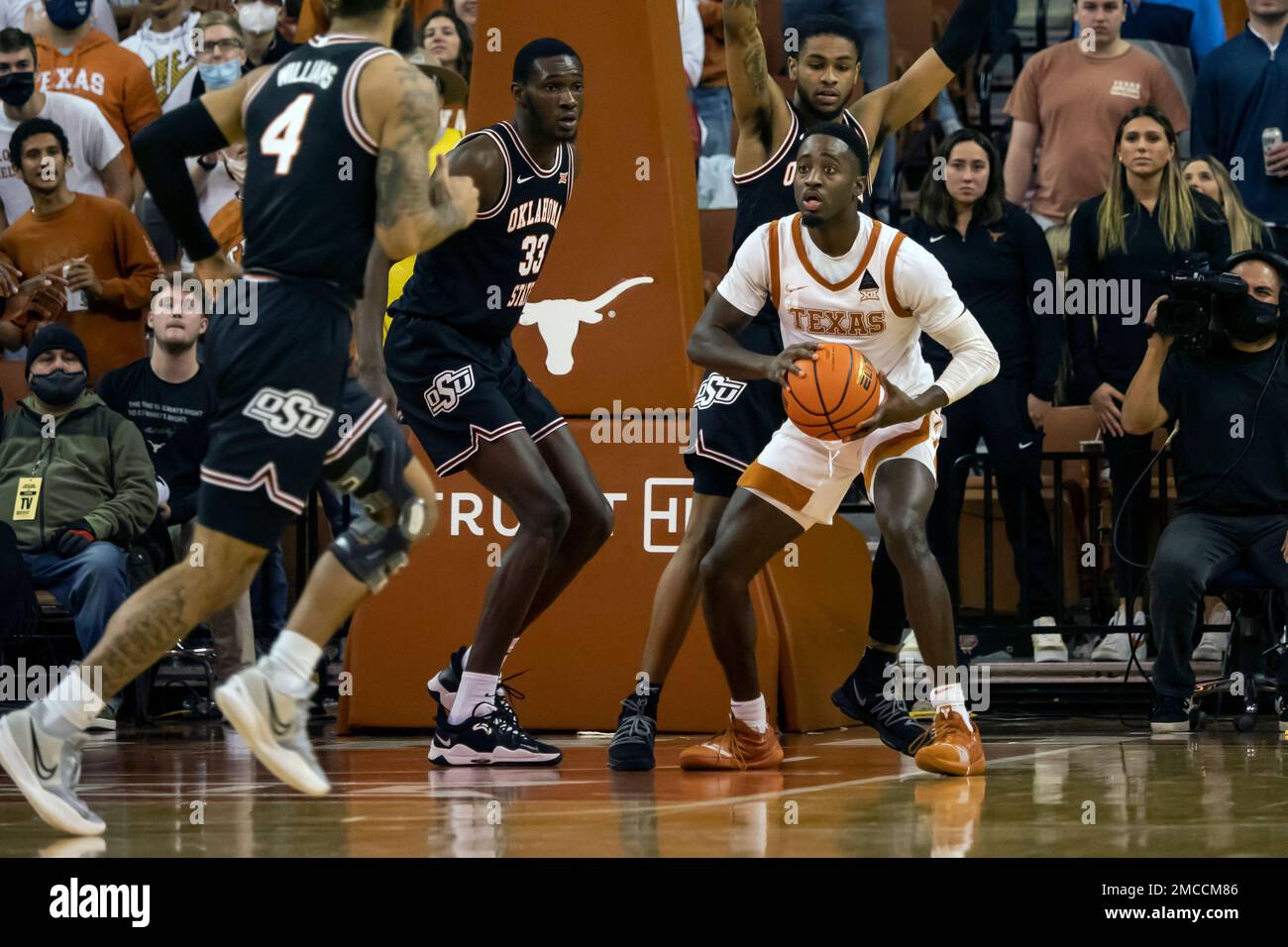 Texas guard Courtney Ramey looks to pass against the Oklahoma State ...