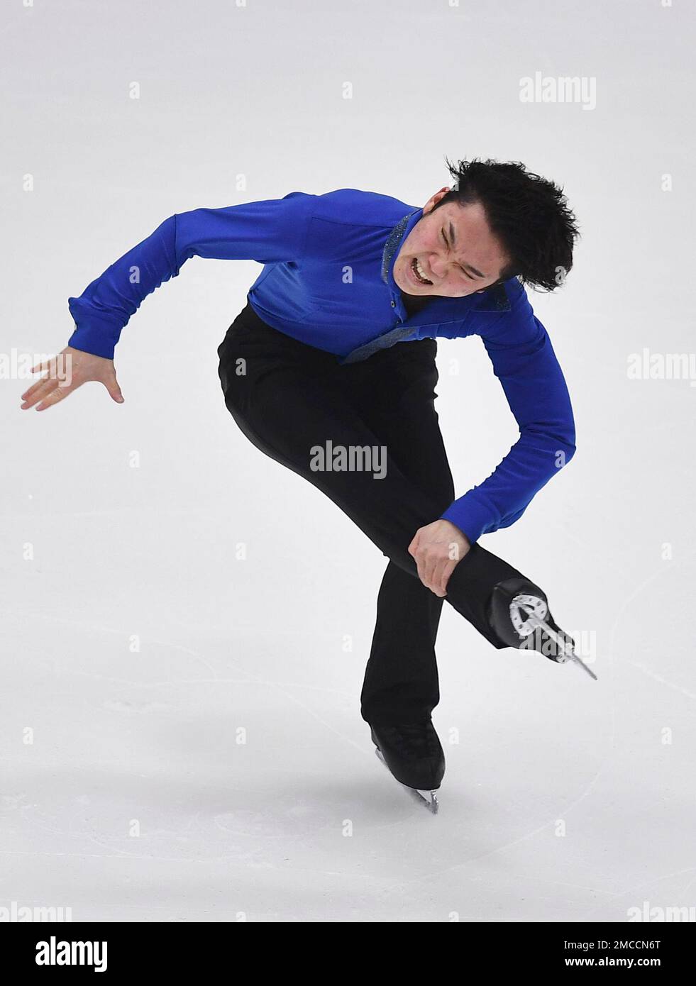 Kazuki Tomono of Japan performs in the men free skating program during ...