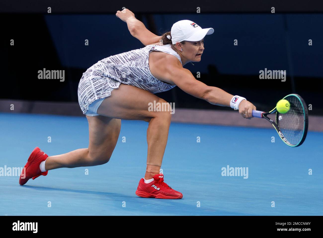 Ash Barty of Australia makes a backhand return to Amanda Anisimova of ...
