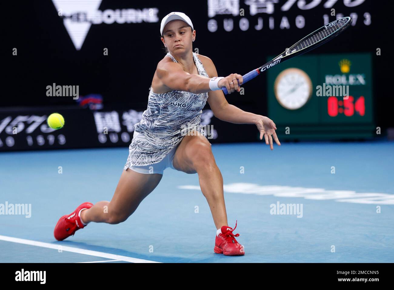Ash Barty of Australia makes a backhand return to Amanda Anisimova of ...
