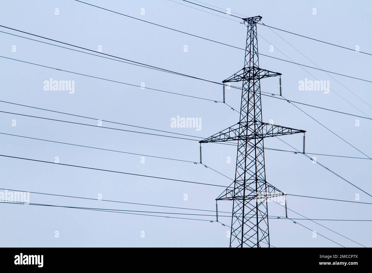 New large mast of an air power line close up, high voltage electricity ...