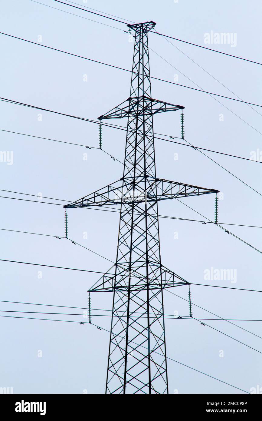 New large mast of an air power line close up, high voltage electricity ...