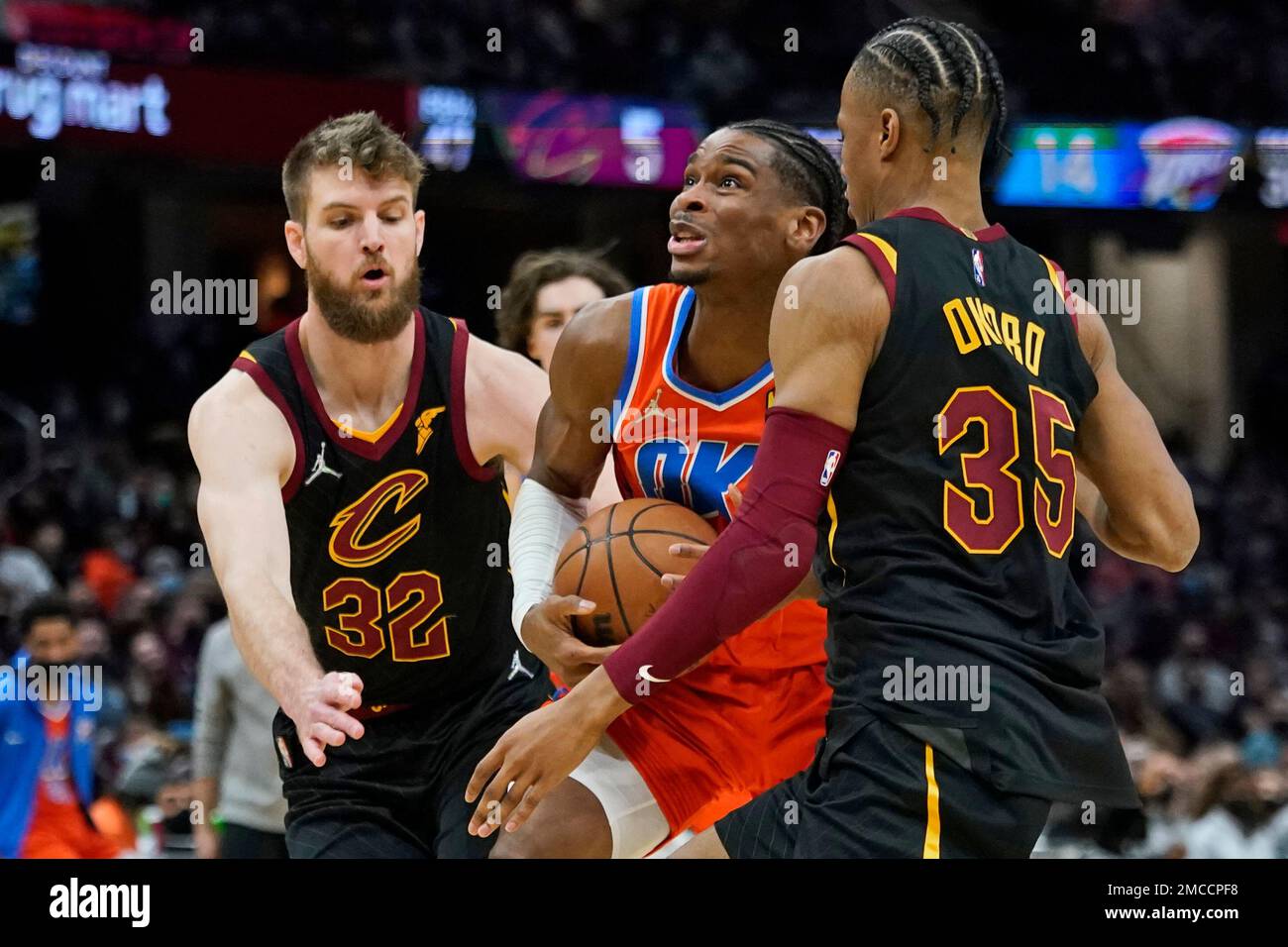 Oklahoma City Thunder's Shai Gilgeous-Alexander, center, drives between ...
