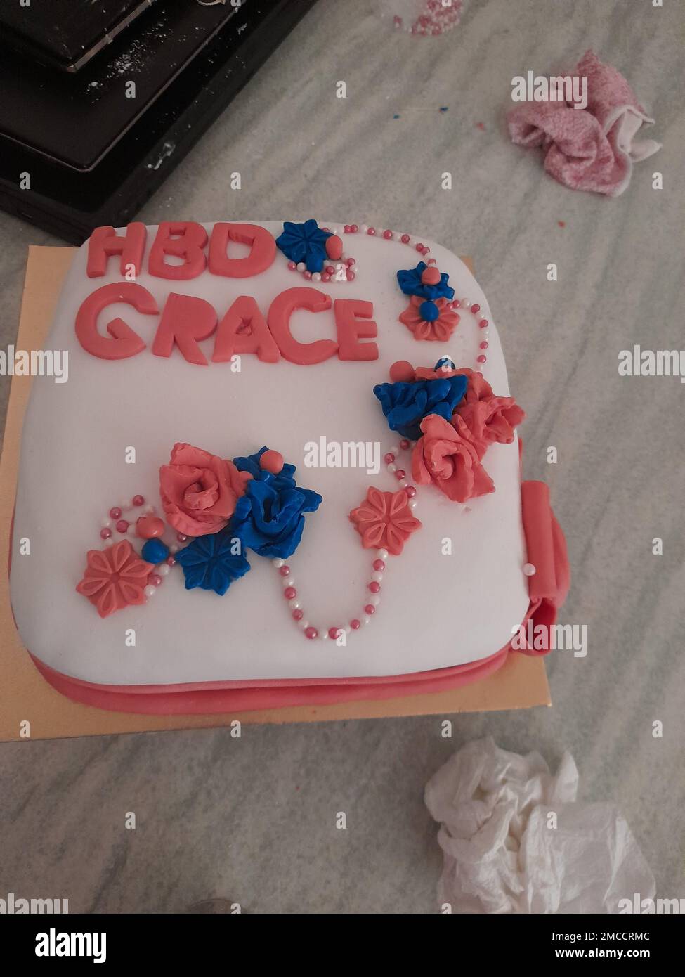 A HBD GRACE cake with flower decorations Stock Photo - Alamy
