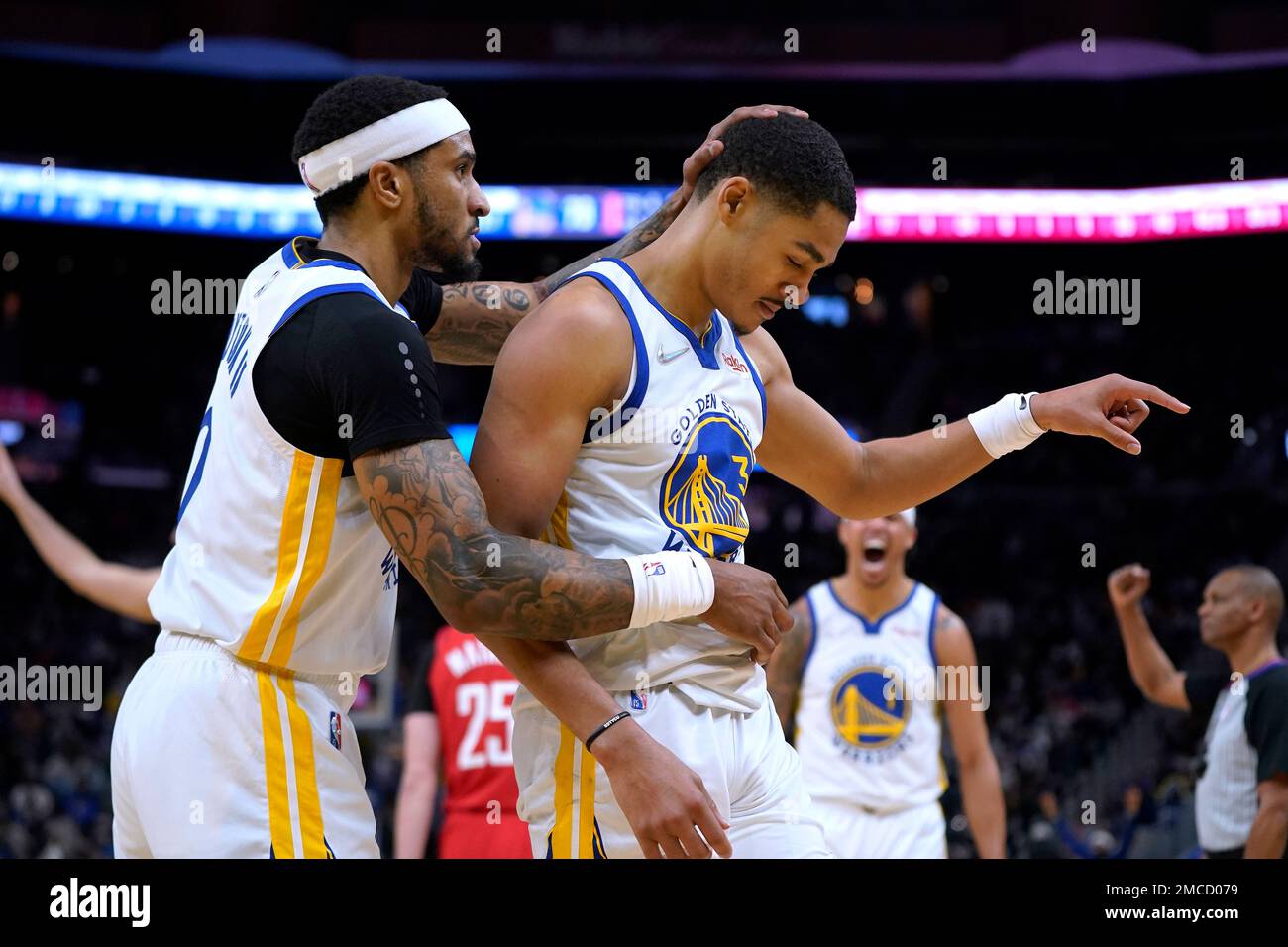 Golden State Warriors guard Jordan Poole, right, is congratulated by guard Gary Payton II after ...