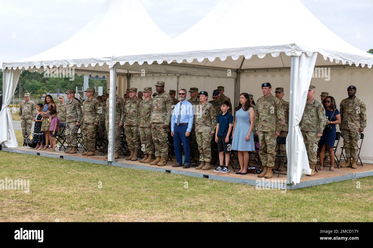 U.S. Soldiers, family, friends and distinguished visitors sing the Army ...