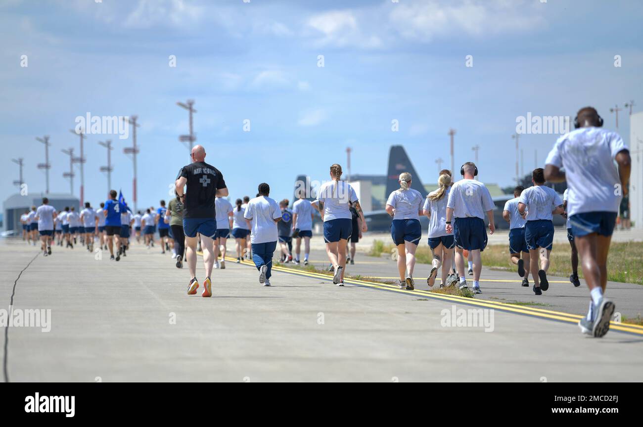 Members of the 86th Airlift Wing participate in a wing run in honor of ...