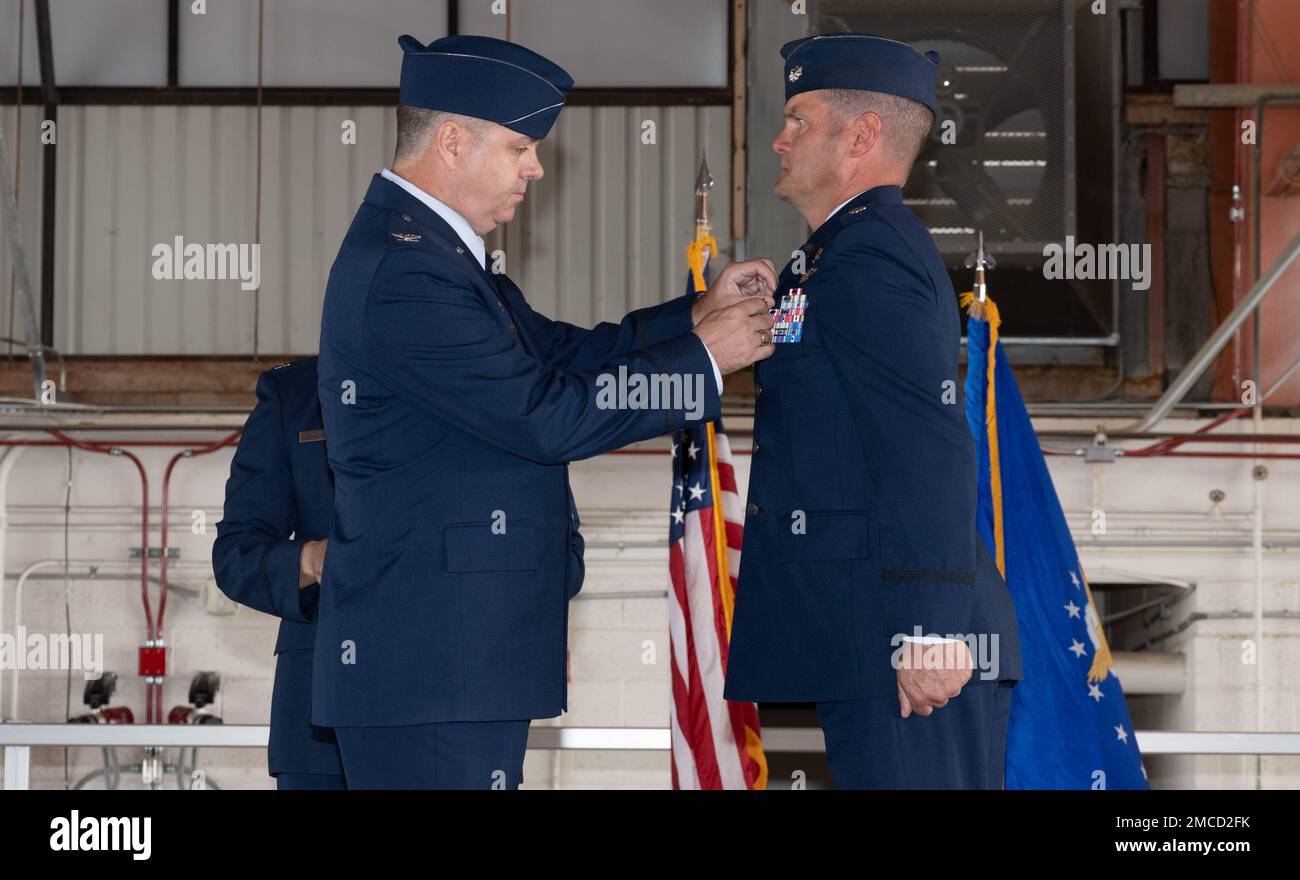 Lt. Col. Brian Davis, 29th Attack Squadron commander, receives a ...