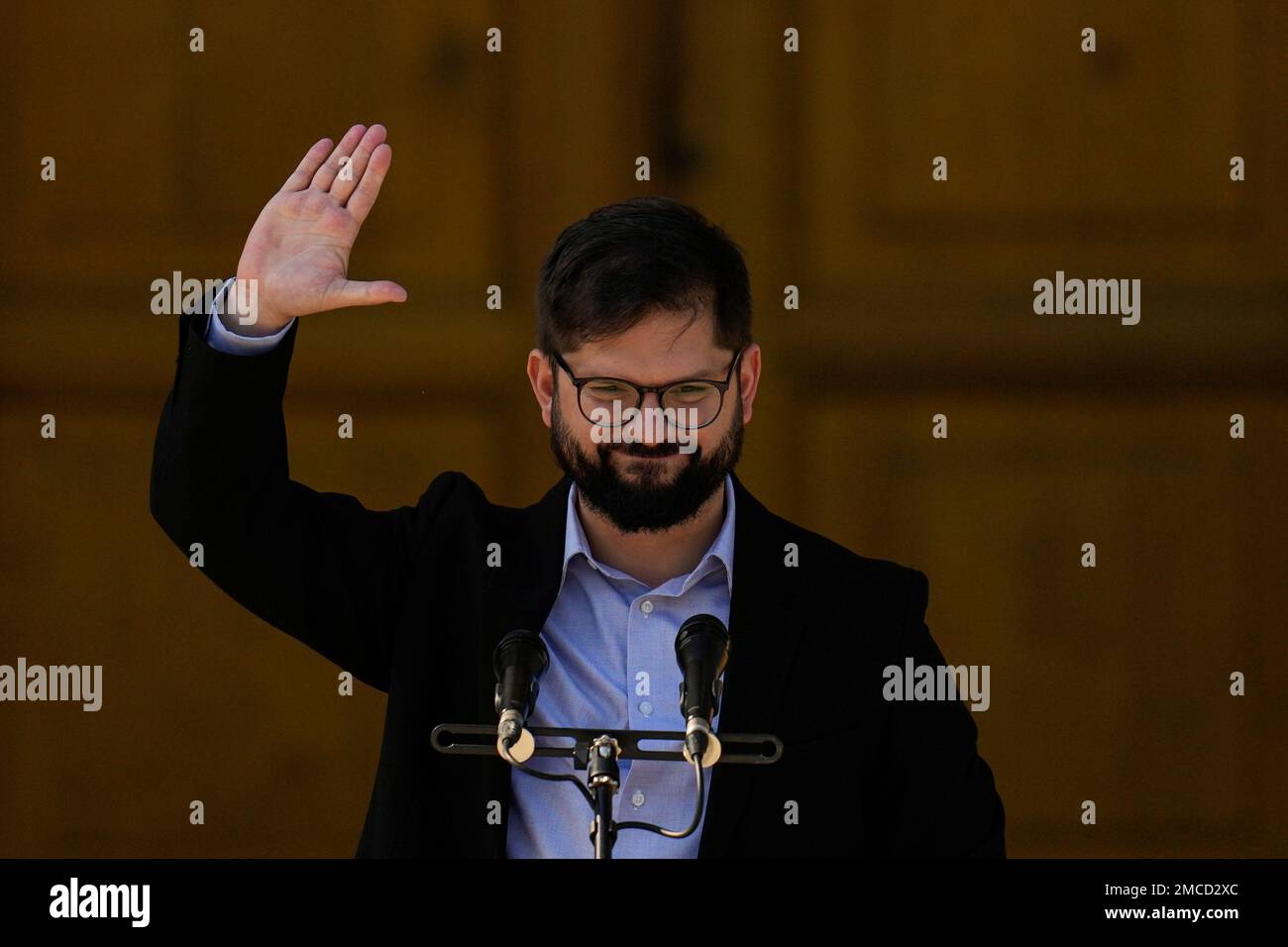 Chilean President-elect Gabriel Boric waves as he announces his cabinet ...