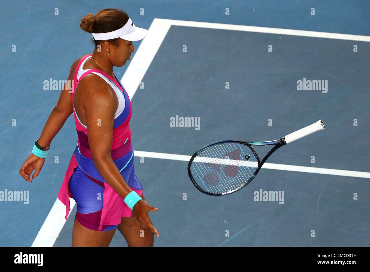 Naomi Osaka of Japan bounces her racket in frustration during her third ...