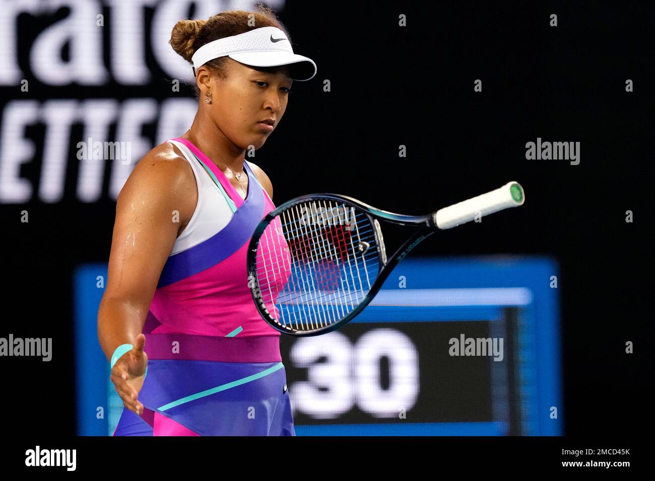 Naomi Osaka of Japan bounces her racket in frustration during her third ...