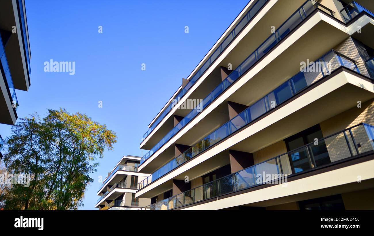 Eco architecture. Green tree and apartment building. The harmony of ...