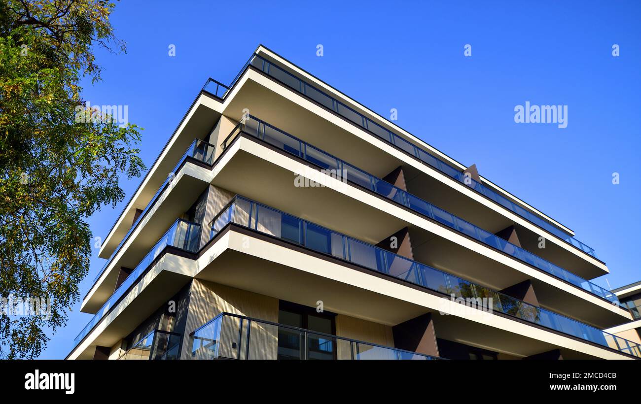 Eco architecture. Green tree and apartment building. The harmony of ...