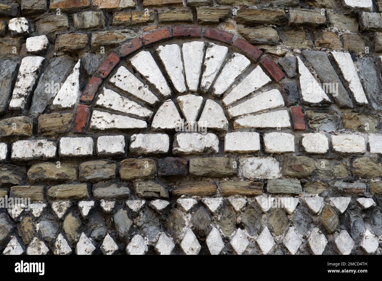 details of the mosaic work on a tower of the historical roman city wall ...
