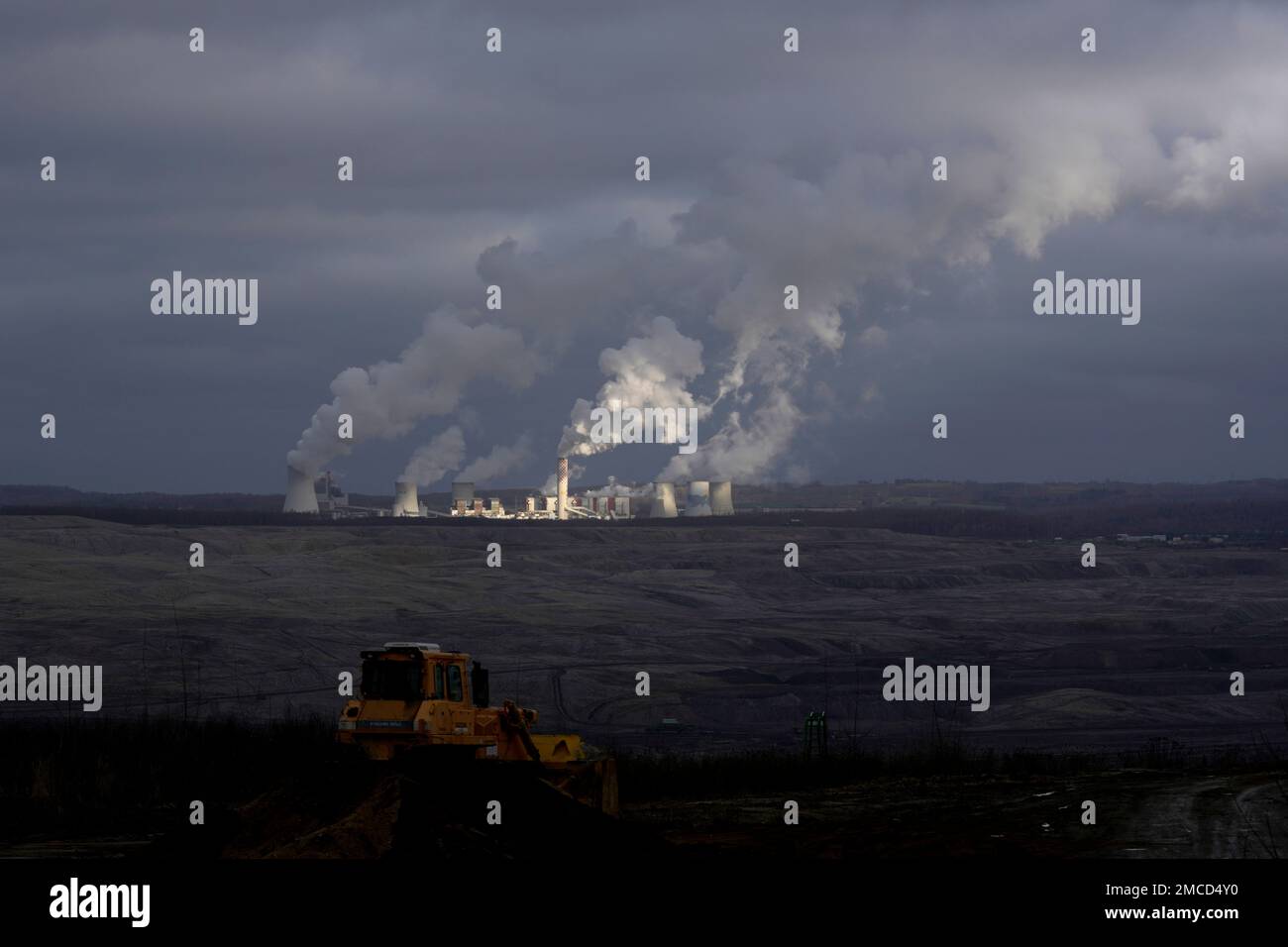 Smoke rises from chimneys of Turow power plant located by the Turow ...