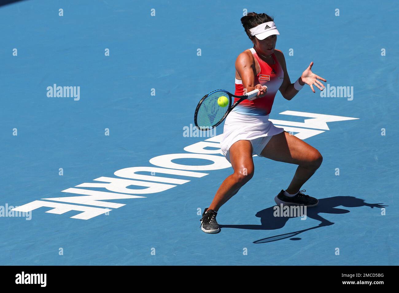 Wang Qiang of China plays a forehand return to Madison Keys of the U.S ...