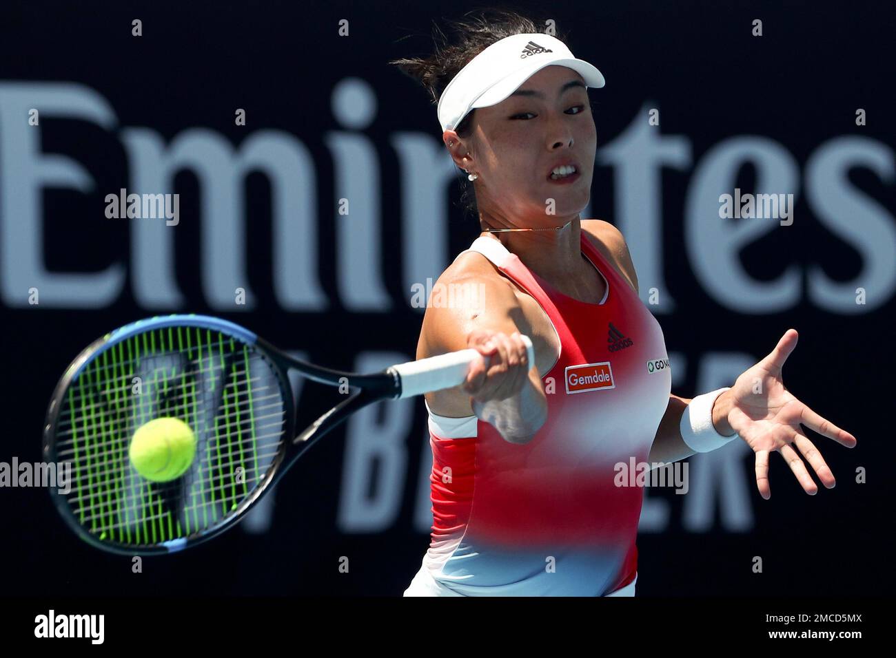 Wang Qiang of China plays a forehand return to Madison Keys of the U.S ...