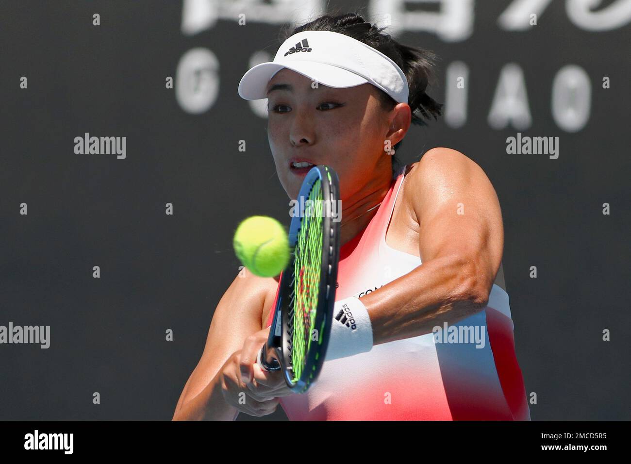 Wang Qiang of China plays a backhand return to Madison Keys of the U.S ...