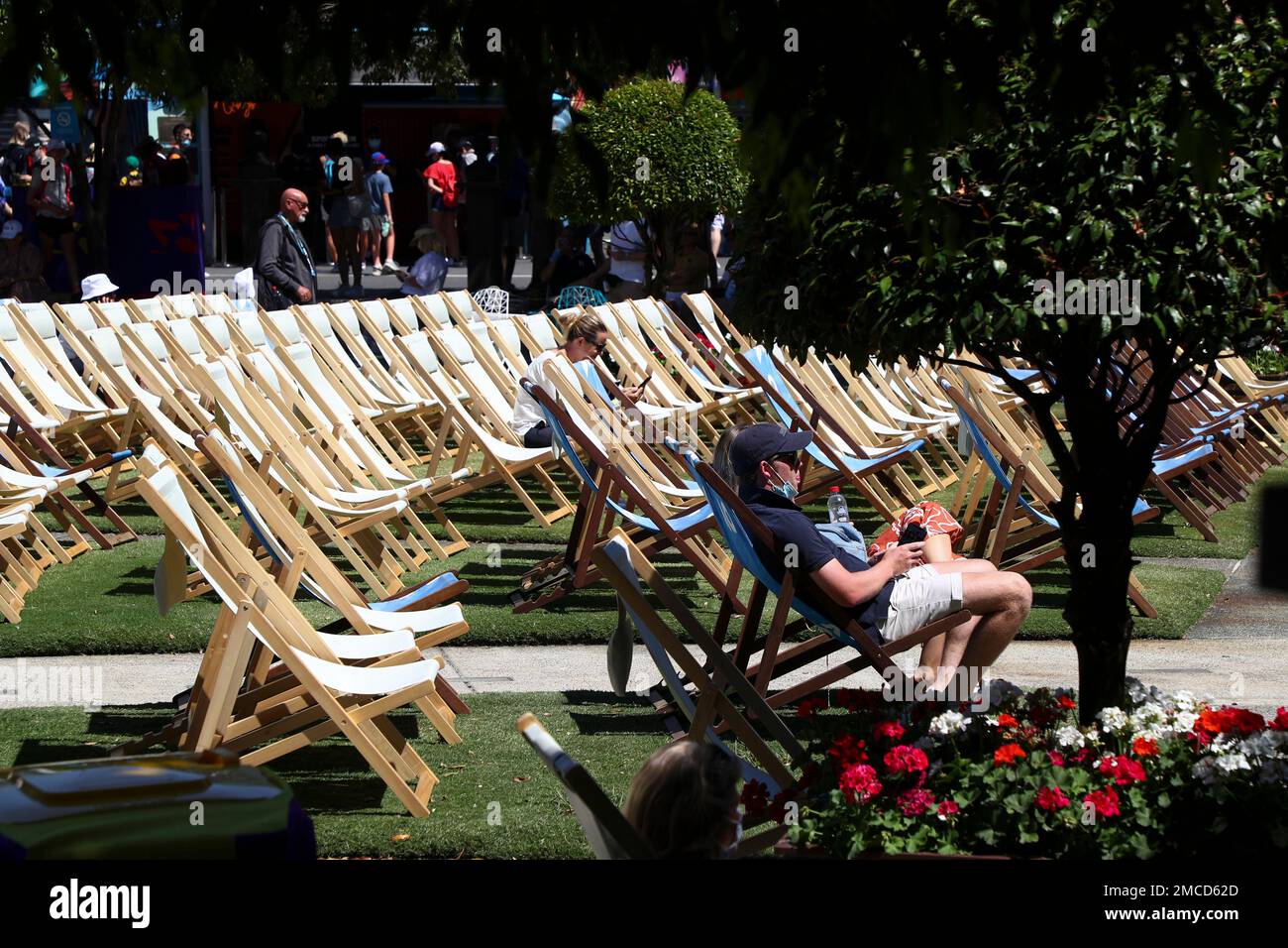 Fans sit in Garden Square at Melbourne Park venue for the Australian ...
