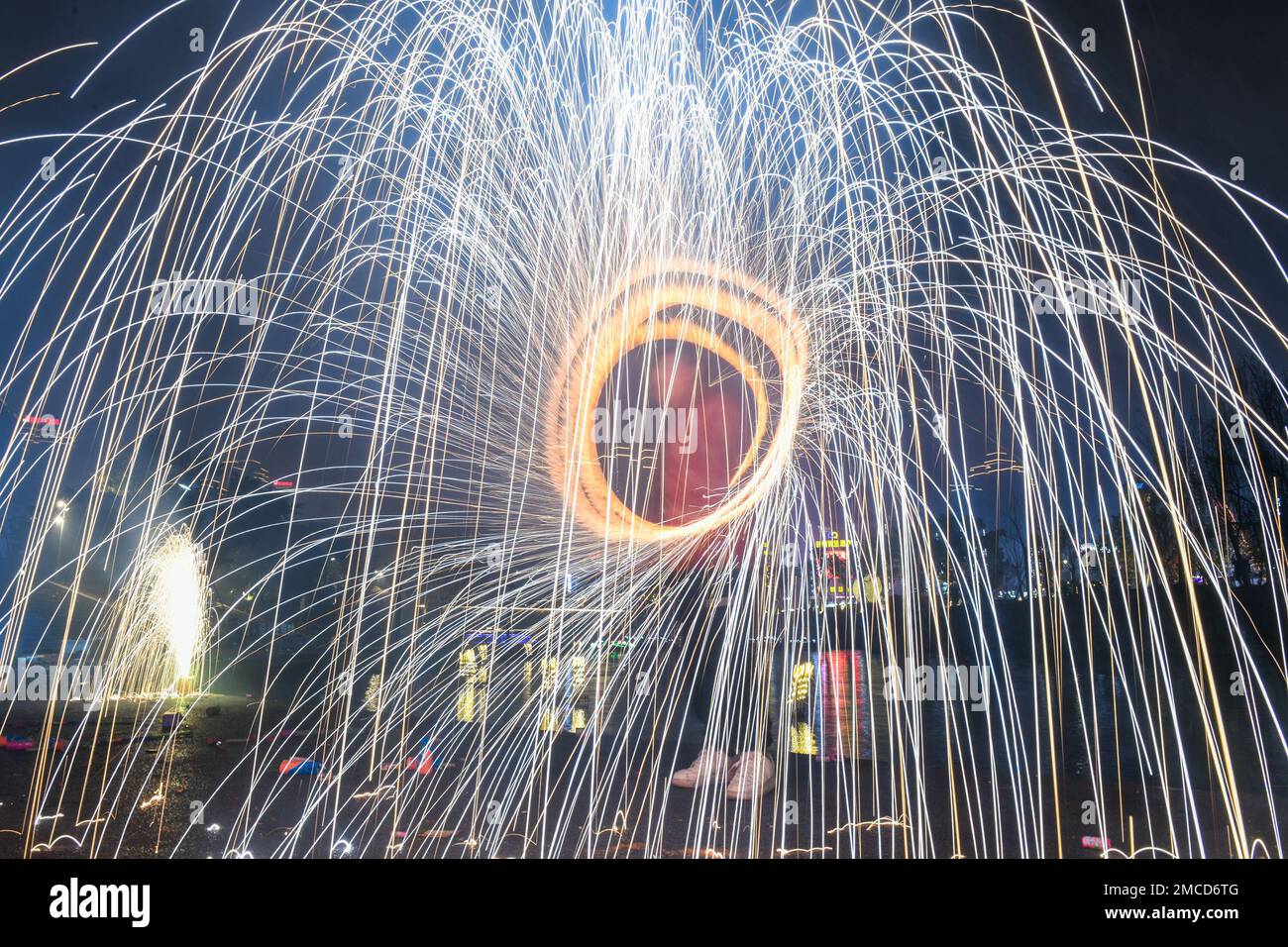QIANNAN, CHINA - JANUARY 21, 2023 - People set off fireworks to ...