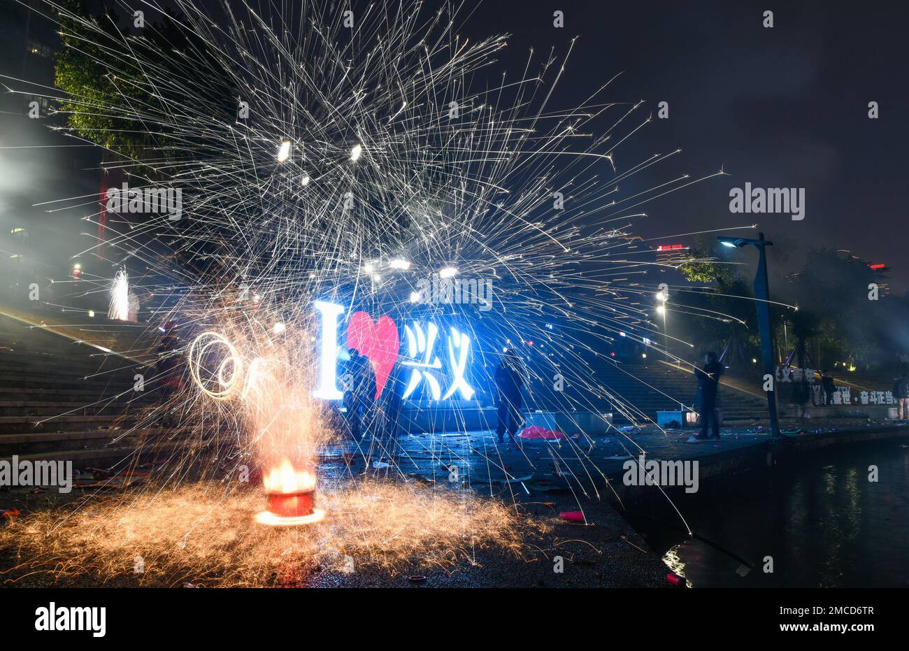 QIANNAN, CHINA - JANUARY 21, 2023 - People set off fireworks to ...