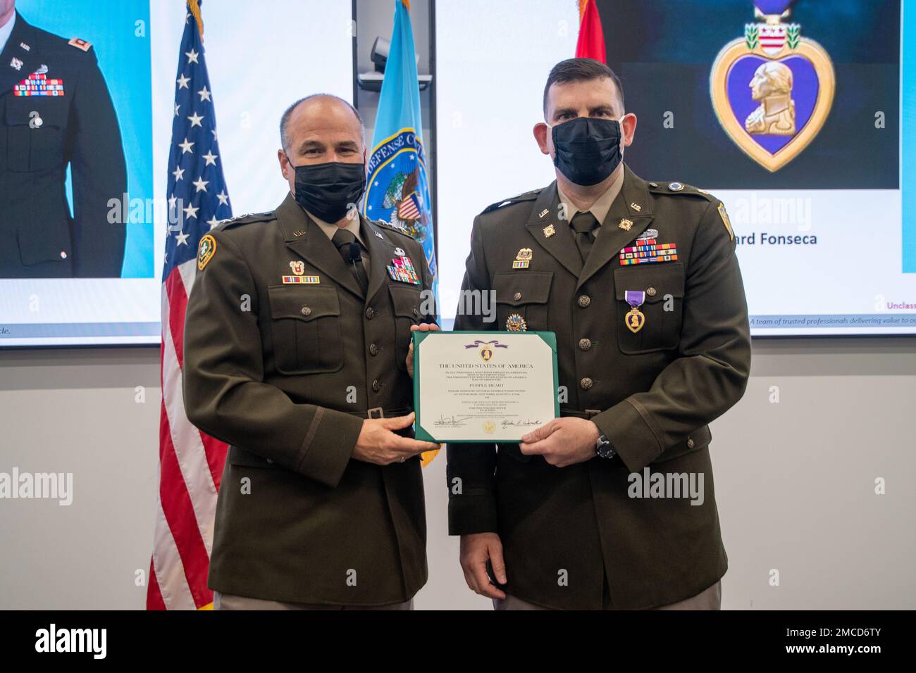Army Maj. Ed Fonseca receives the Purple Heart from Lt. Gen. David ...