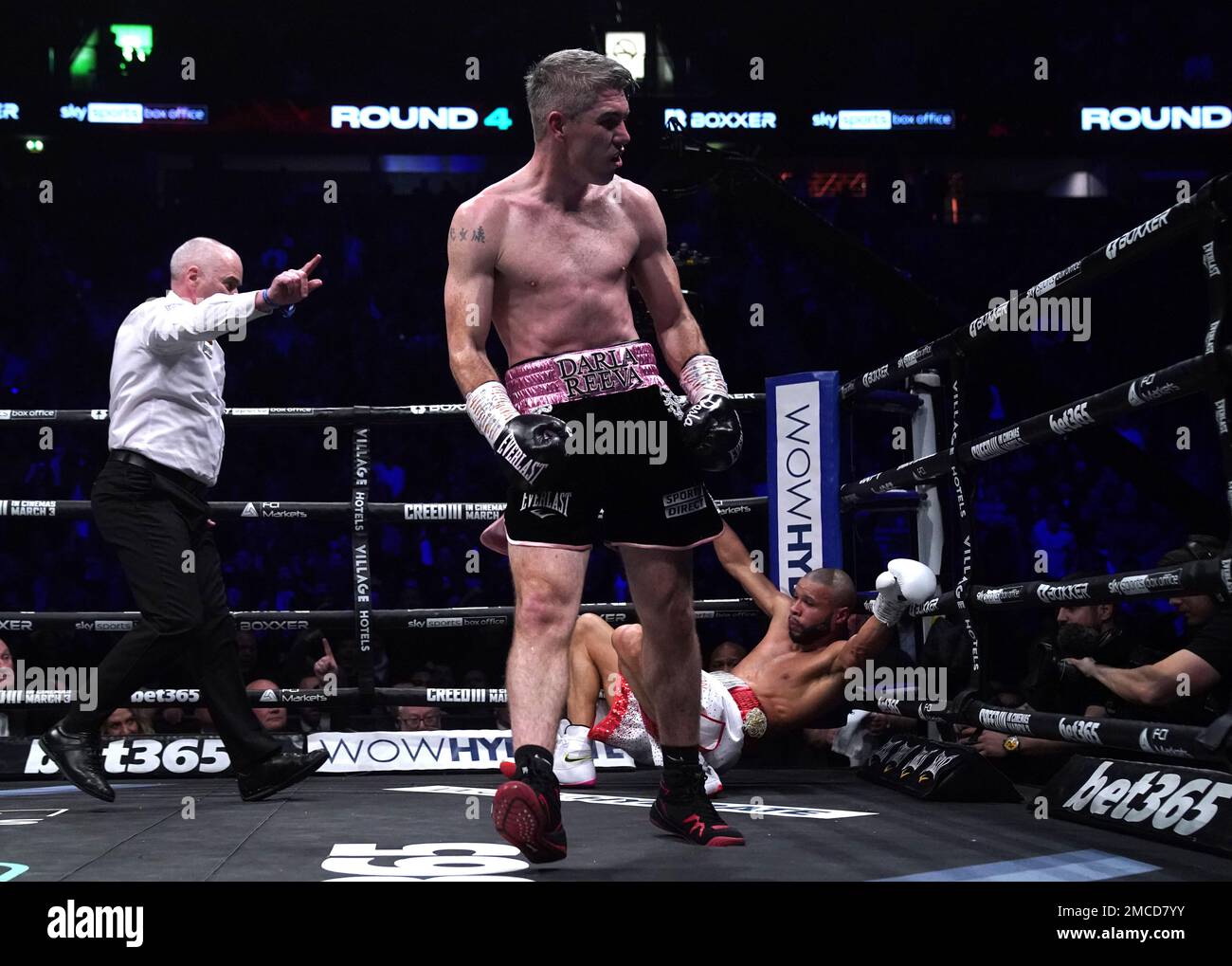 Liam Smith (left) knocks down Chris Eubank Jr in the middleweight bout ...