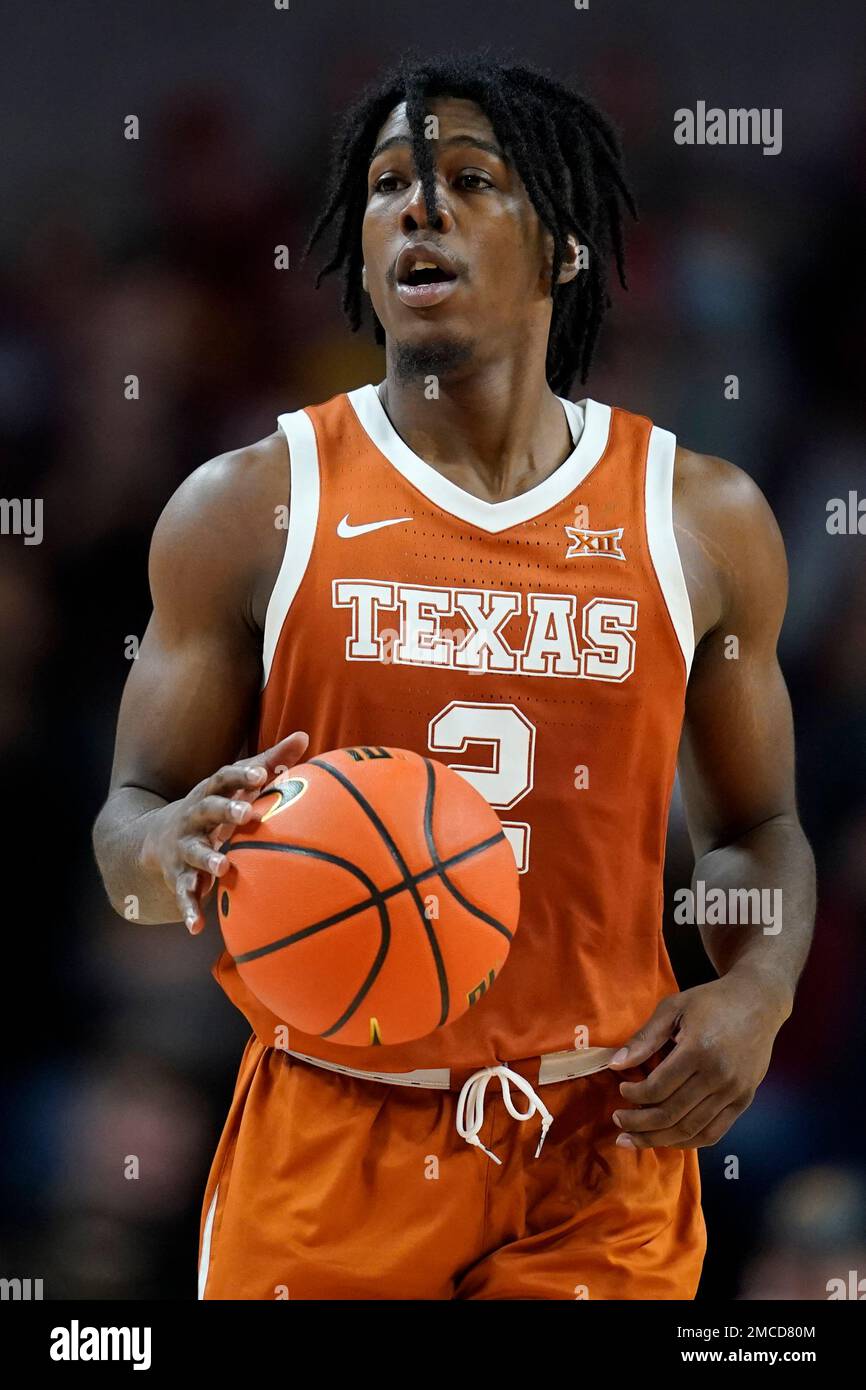 Texas guard Marcus Carr drives up court during an NCAA college ...