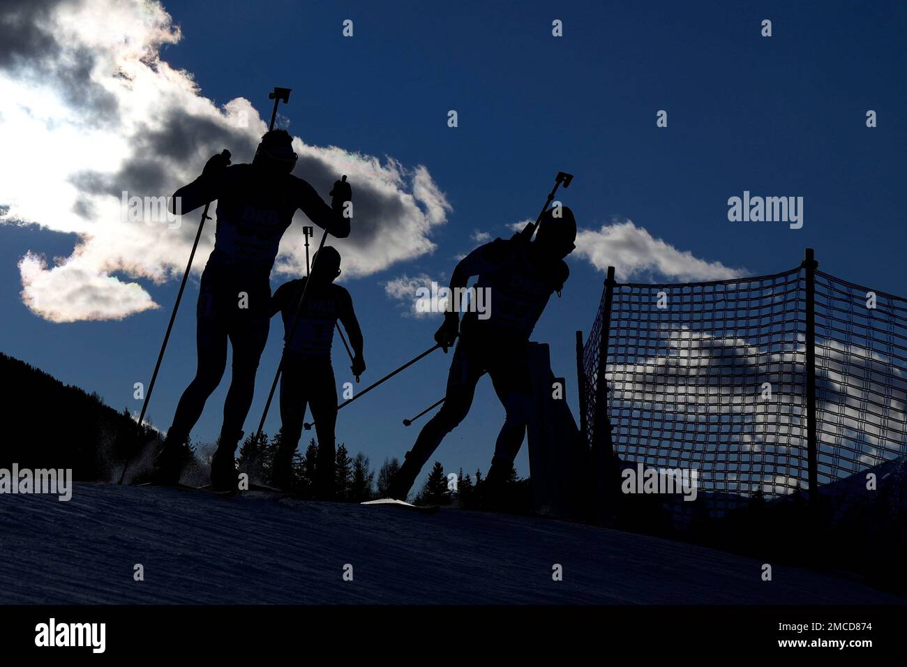 Dominik Windisch of Italy, from left, David Zobel of Germany and Kosuke Ozaki of Japan compete ...