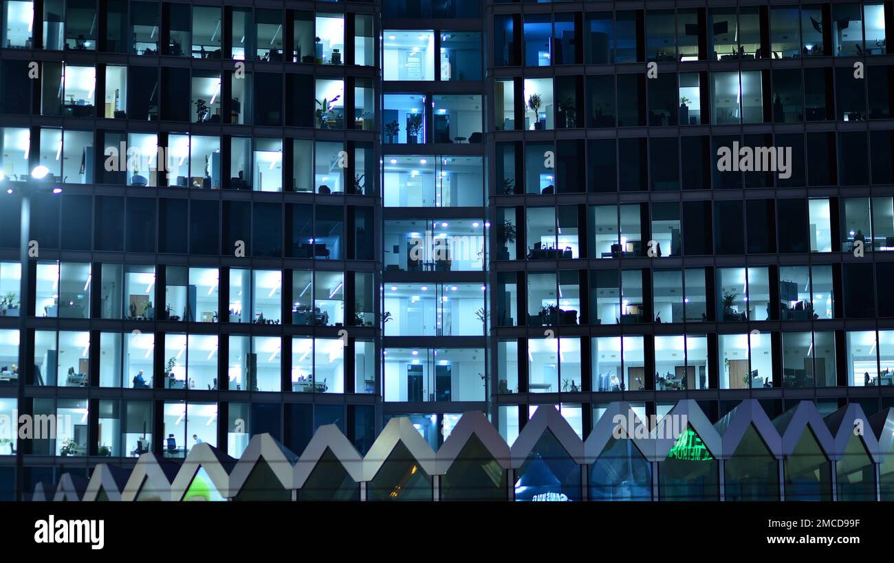 Modern office building in city at the night. View on illuminated ...