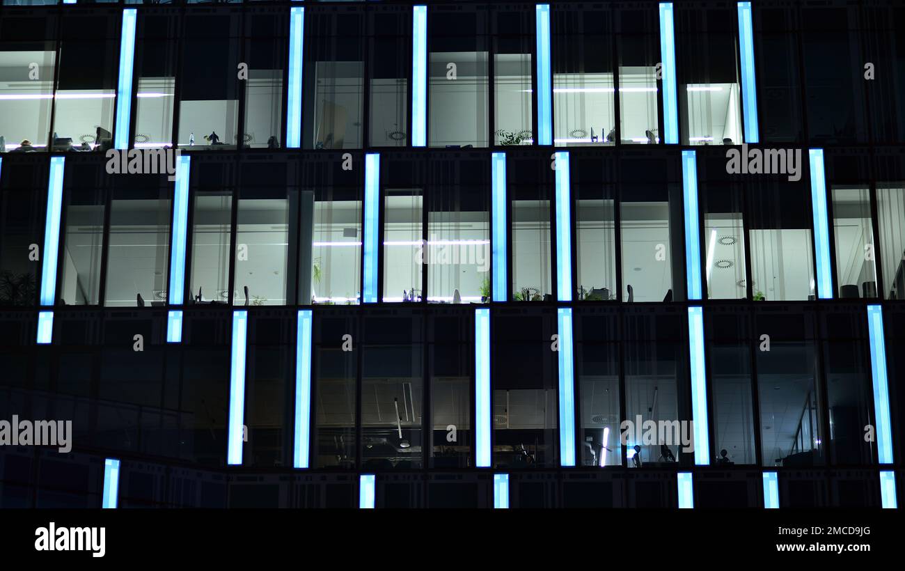 Modern office building in city at the night. View on illuminated ...