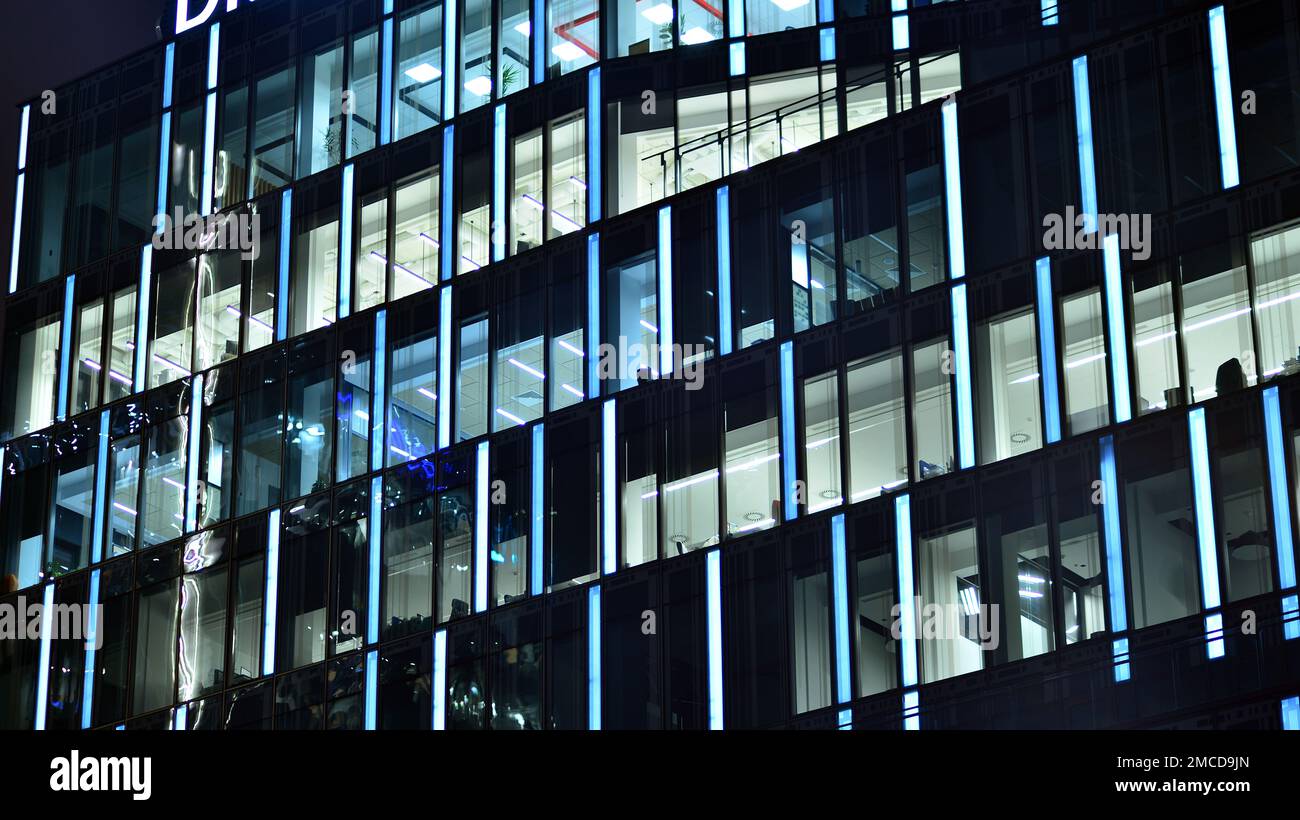 Modern office building in city at the night. View on illuminated ...