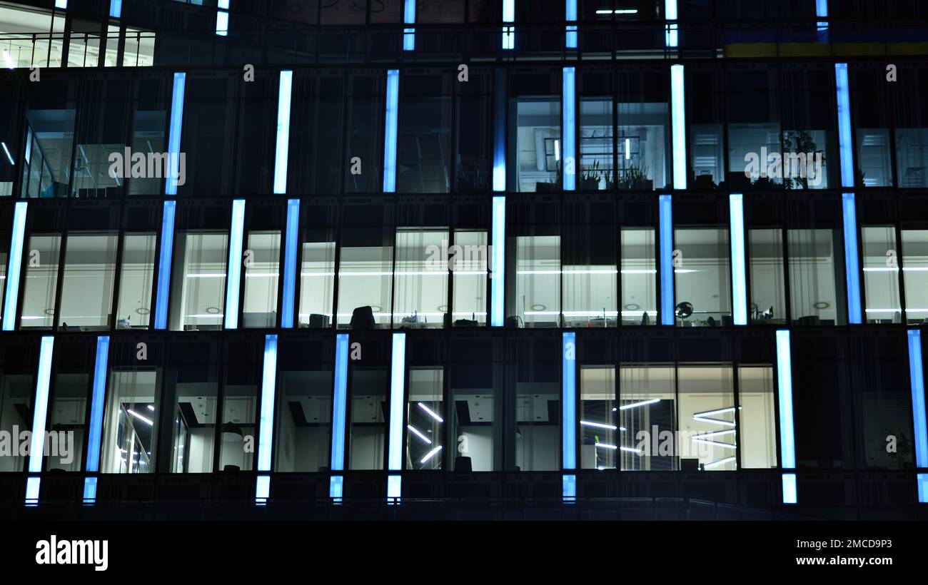 Modern office building in city at the night. View on illuminated ...