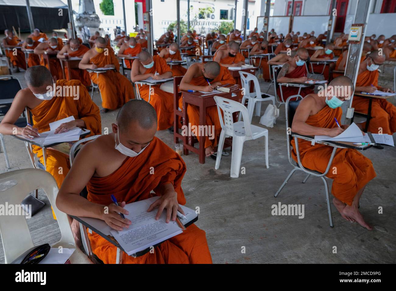 Buddhist monks wearing face masks to help protect themselves from the ...