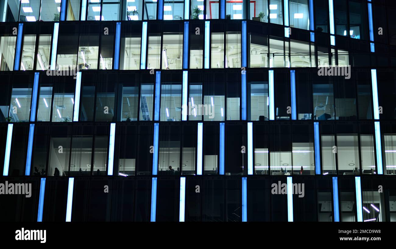 Modern office building in city at the night. View on illuminated ...