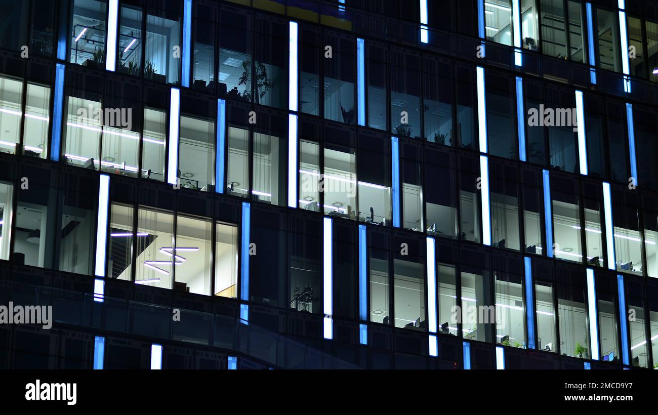 Modern office building in city at the night. View on illuminated ...