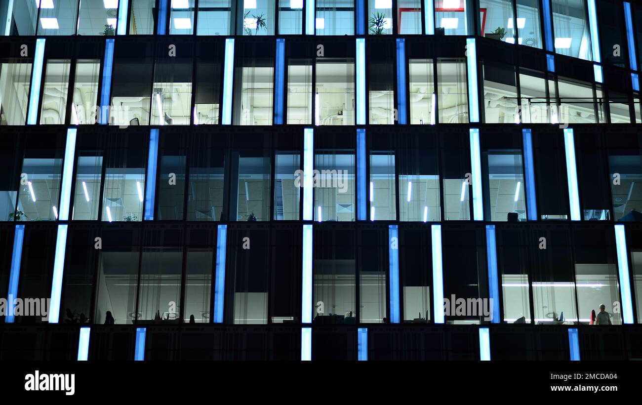 Modern office building in city at the night. View on illuminated ...
