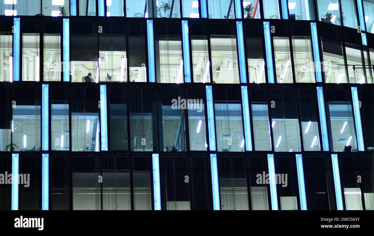 Modern office building in city at the night. View on illuminated ...