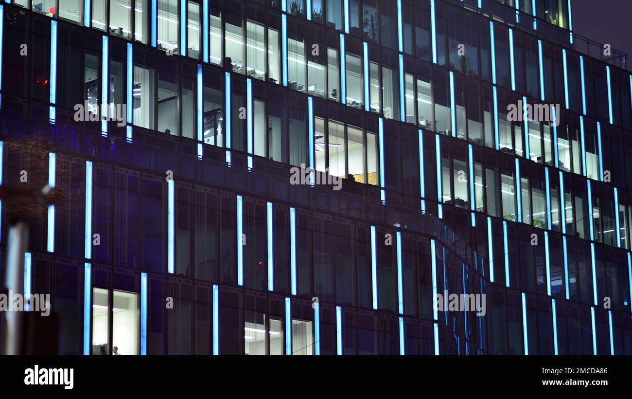 Modern office building in city at the night. View on illuminated ...